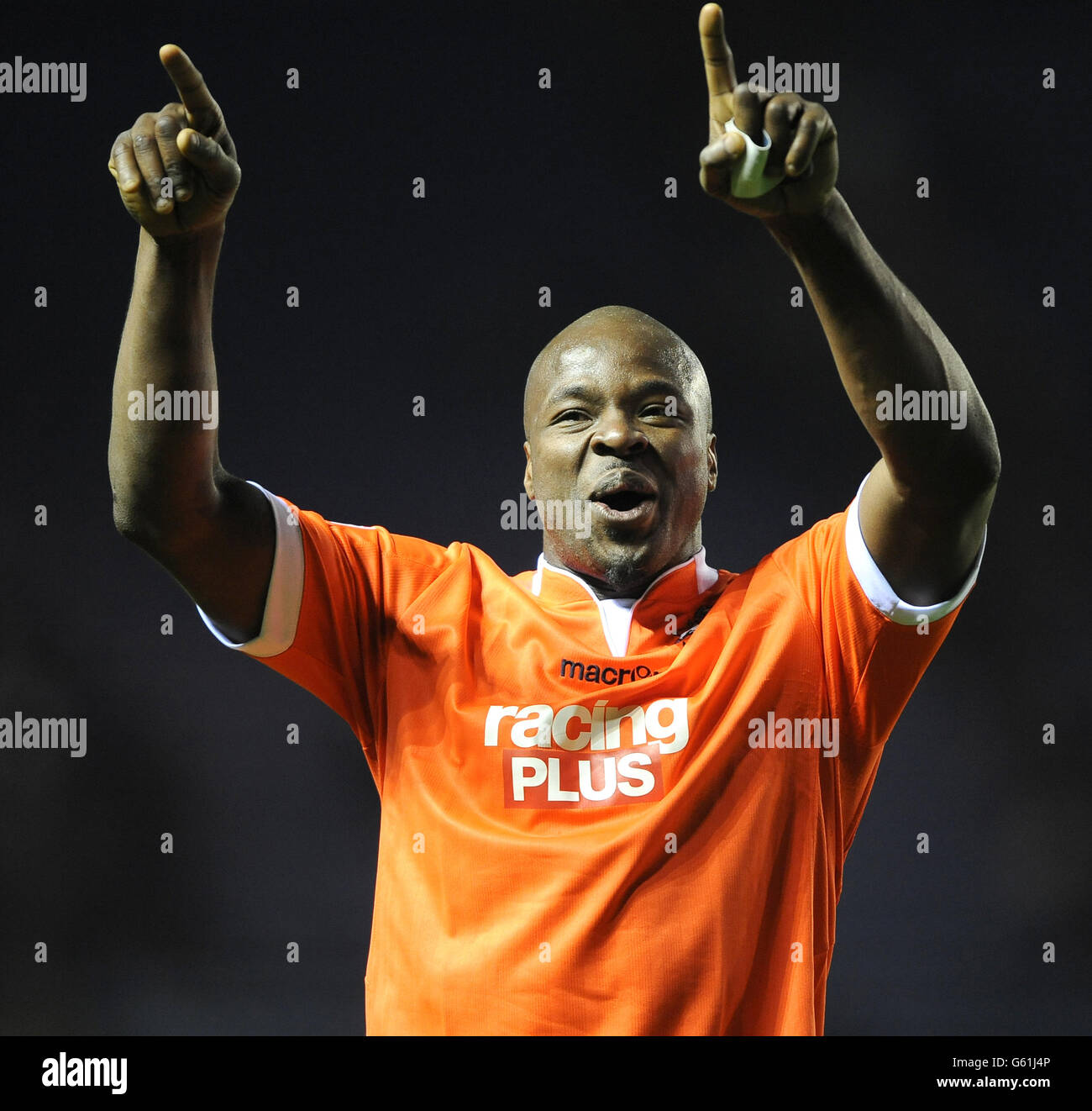 Millwall's Captain, Danny Shittu celebrates with the traveling fans ...