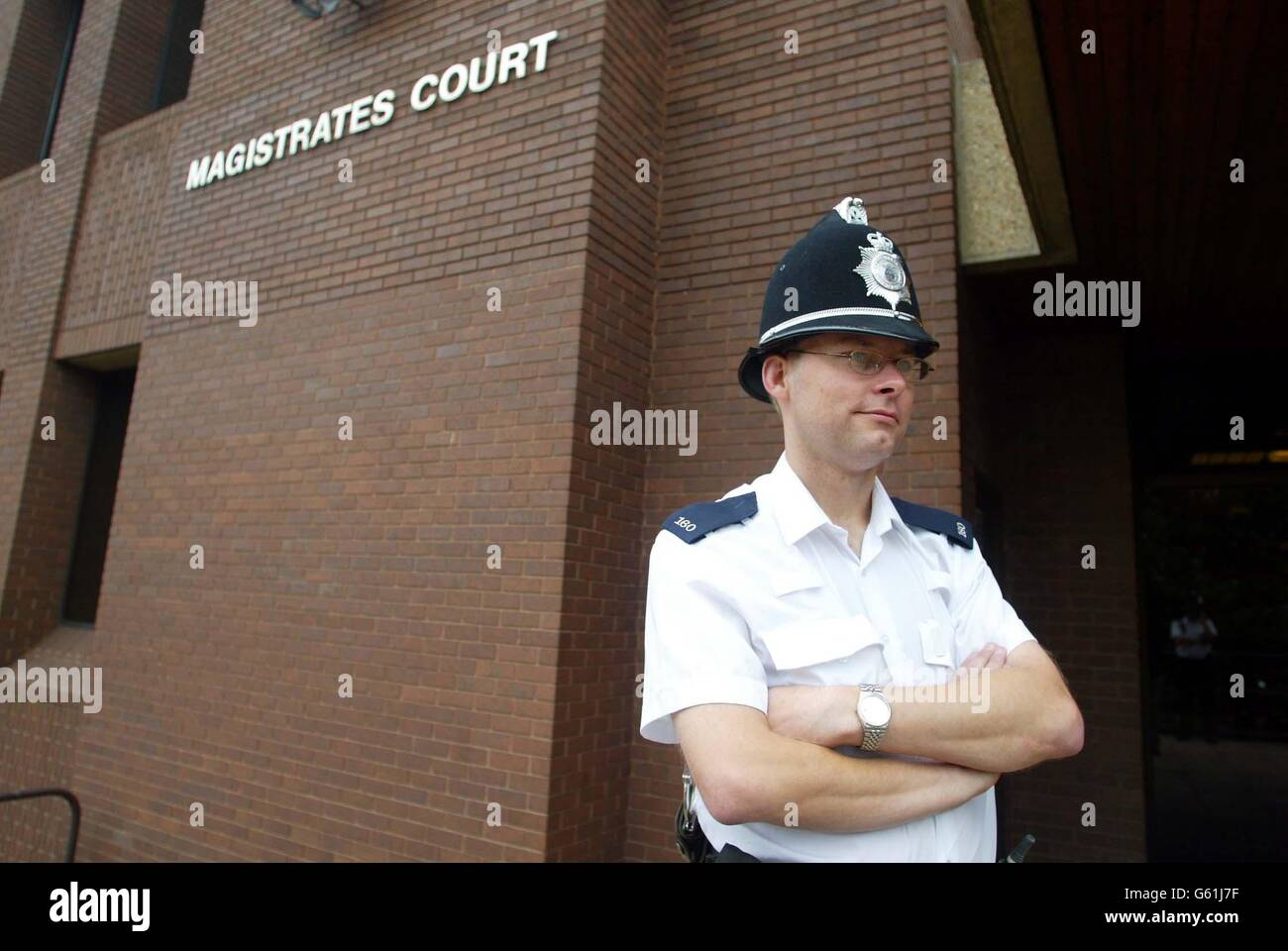 Crime exterior court suspect police arms folded hi-res stock ...