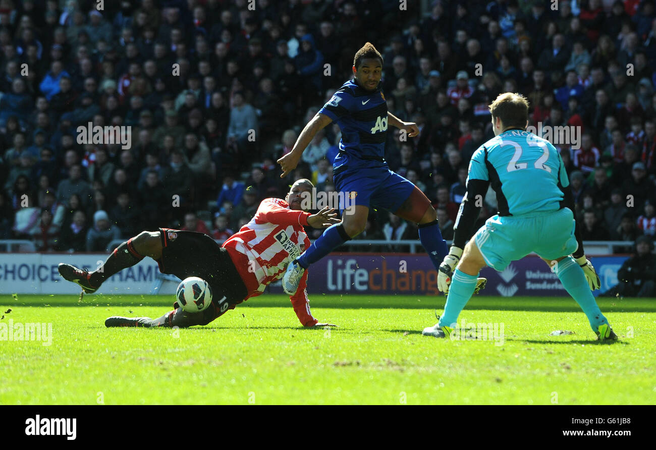 Sunderland's Titus Bramble (left) makes a challenge on Manchester ...