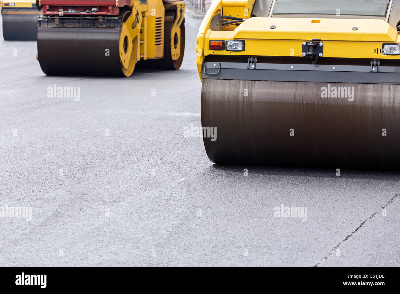 Heavy vibration road rollers at asphalt pavement works Stock Photo - Alamy