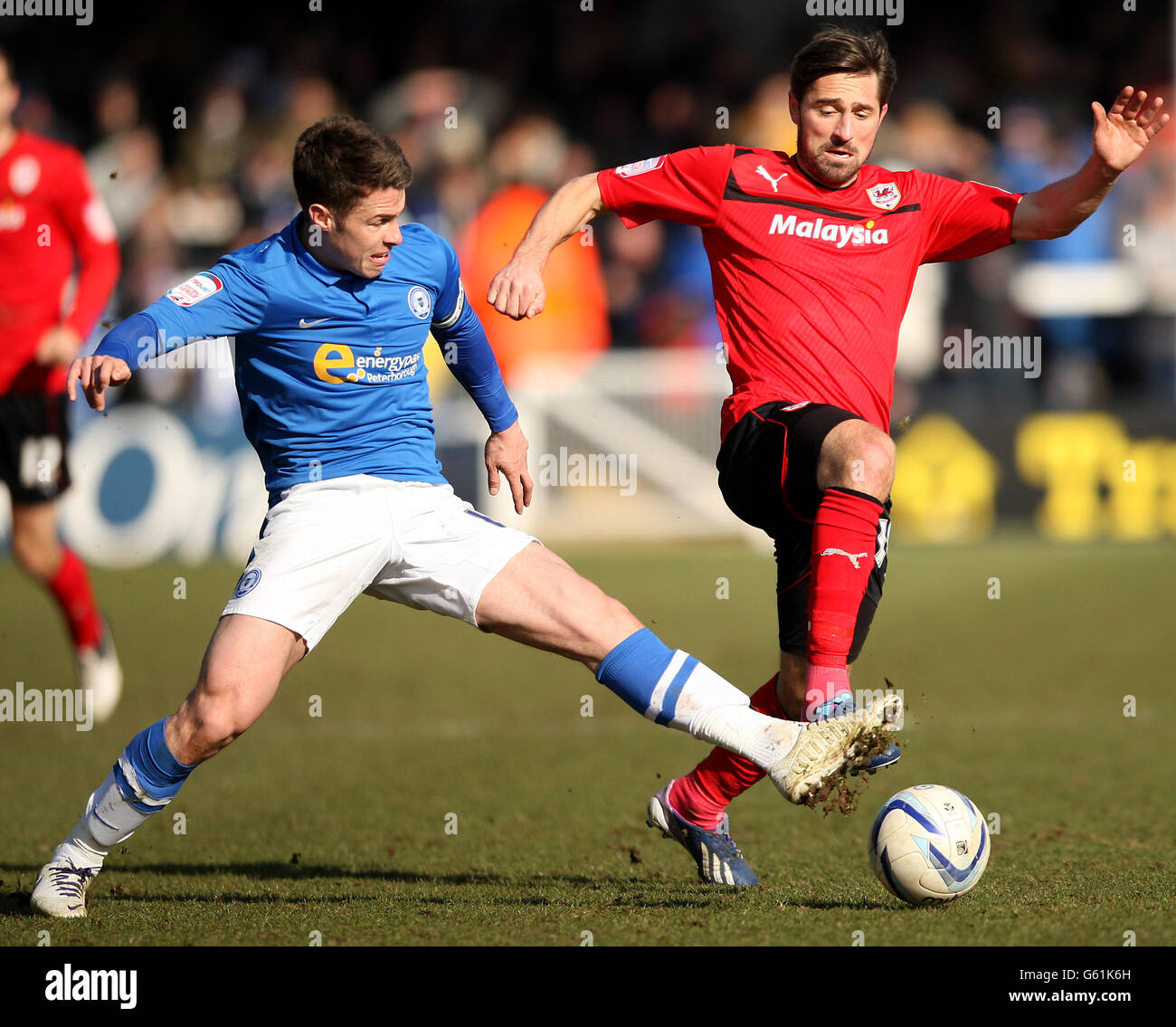 Peterborough United's Tommy Rowe and Cardiff City's Tommy Smith battle ...