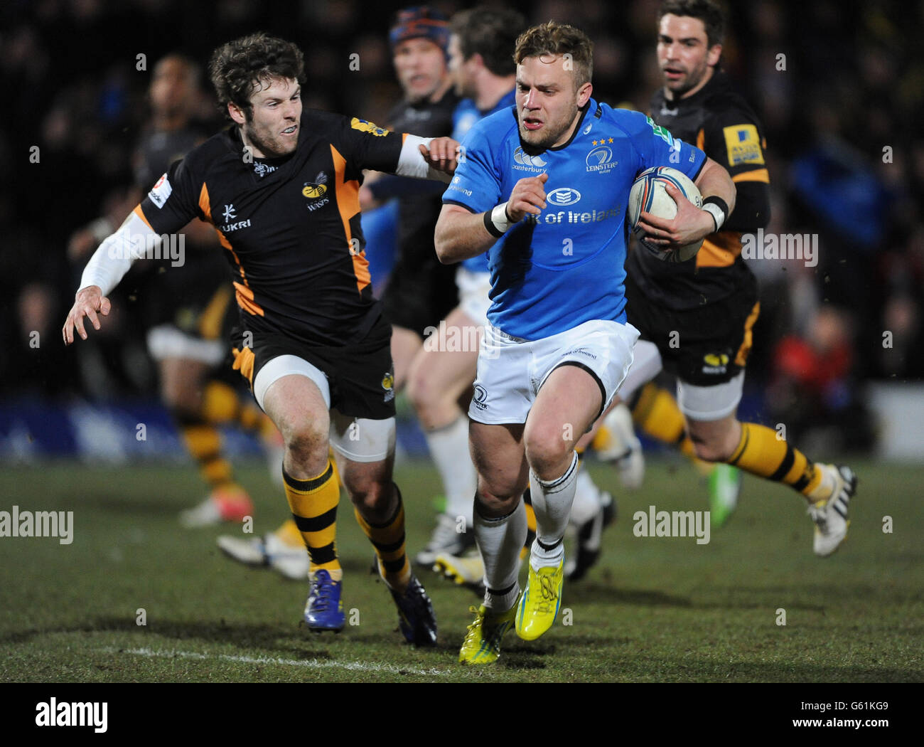 Leinster's Ian Madigan (right) evades a tackle from Wasps Elliot Daly ...