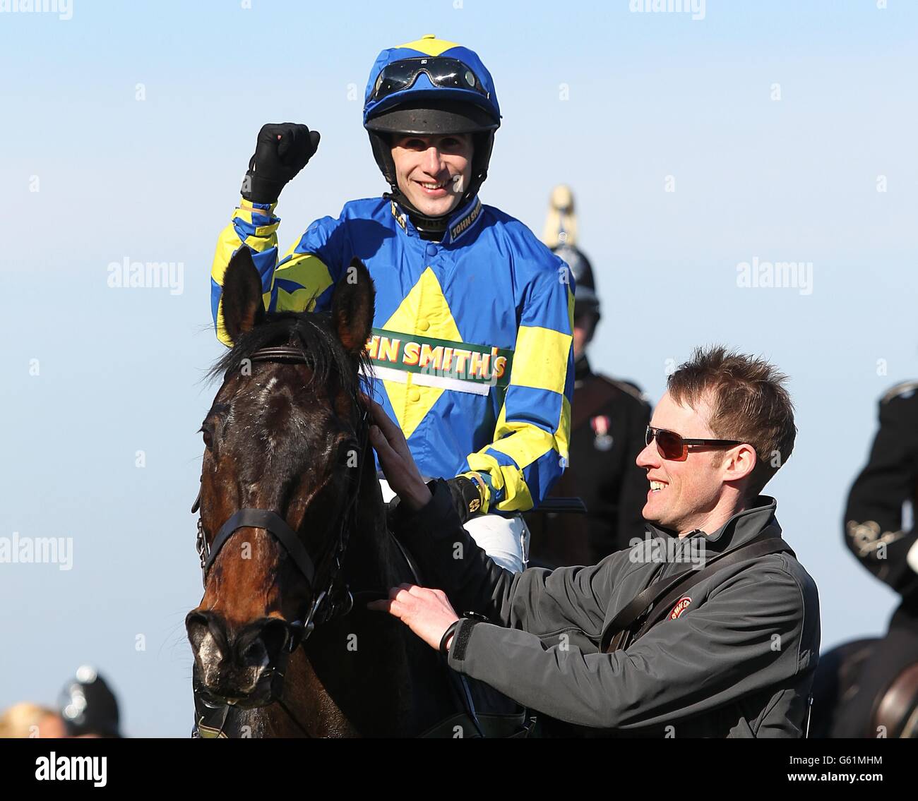 Ryan Mania celebrates on Auroras Encore after winning the John Smith's ...