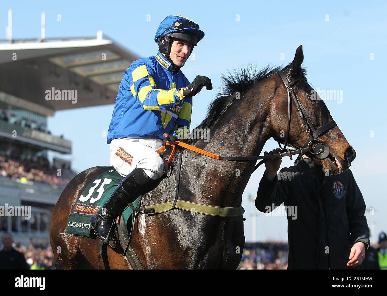 Ryan Mania celebrates on Auroras Encore after winning the John Smith's ...