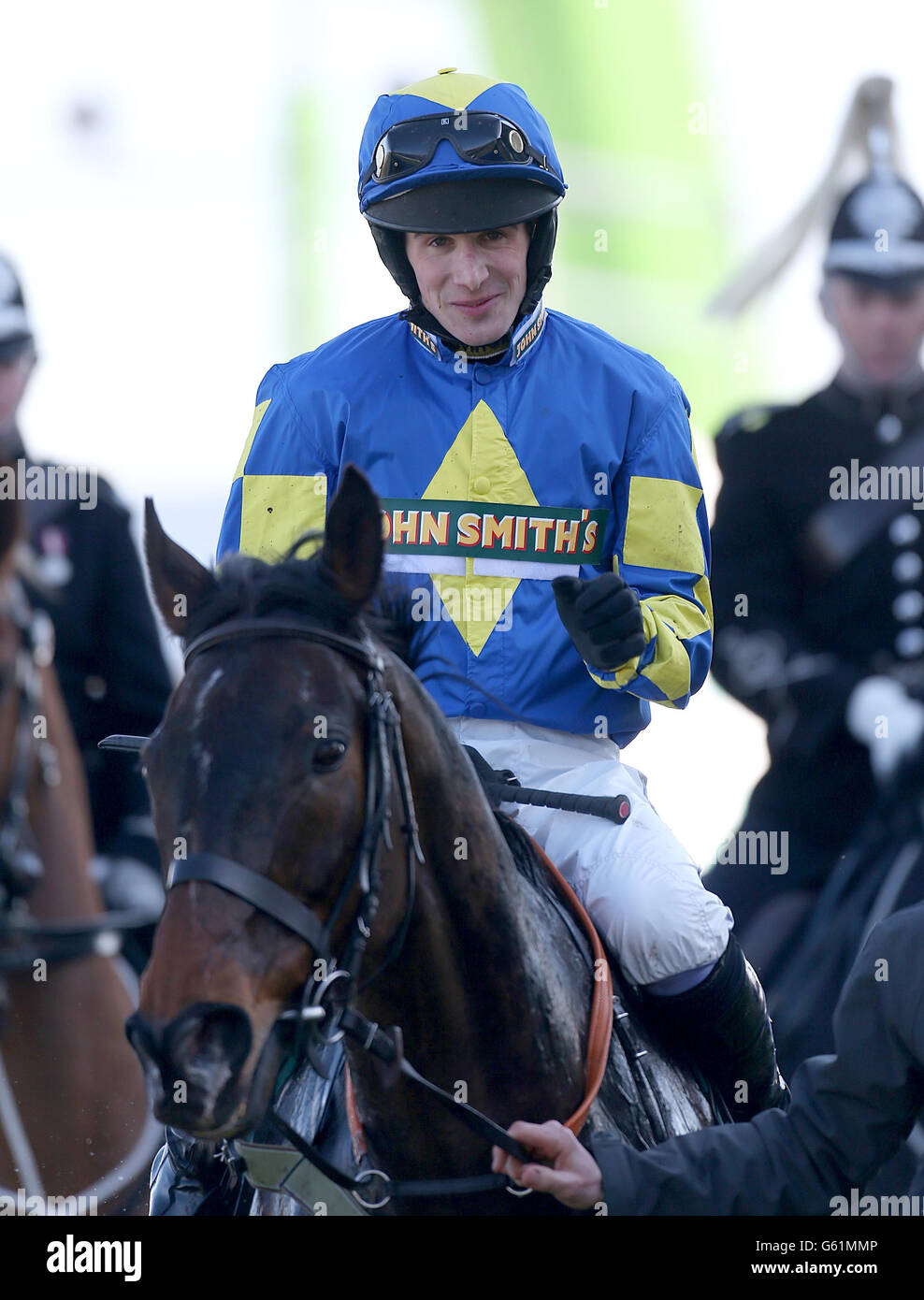 Ryan Mania celebrates on Auroras Encore after winning the John Smith's ...