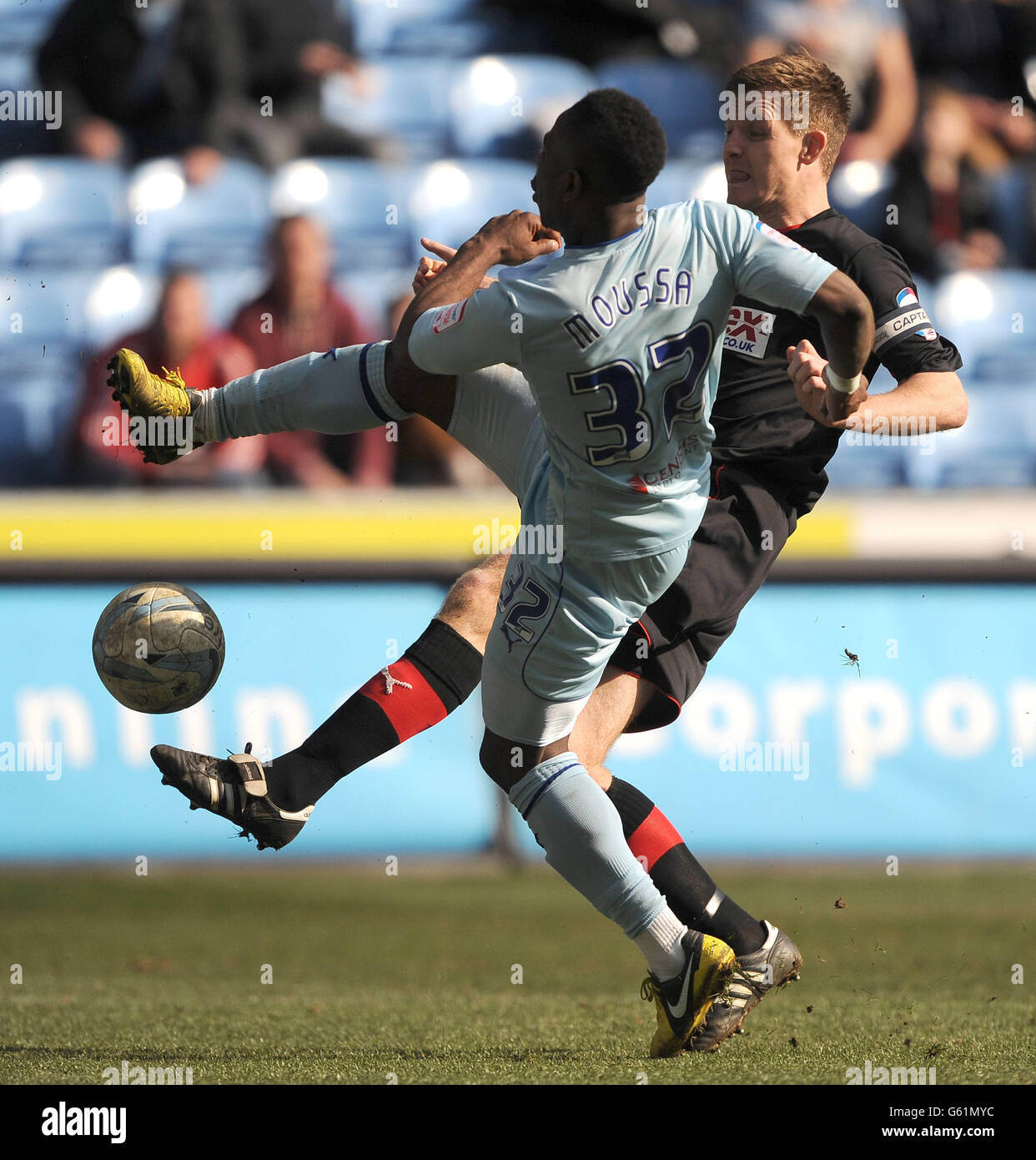 Coventry City's Franck Moussa (left) and Brentford's Tony Craig (right ...