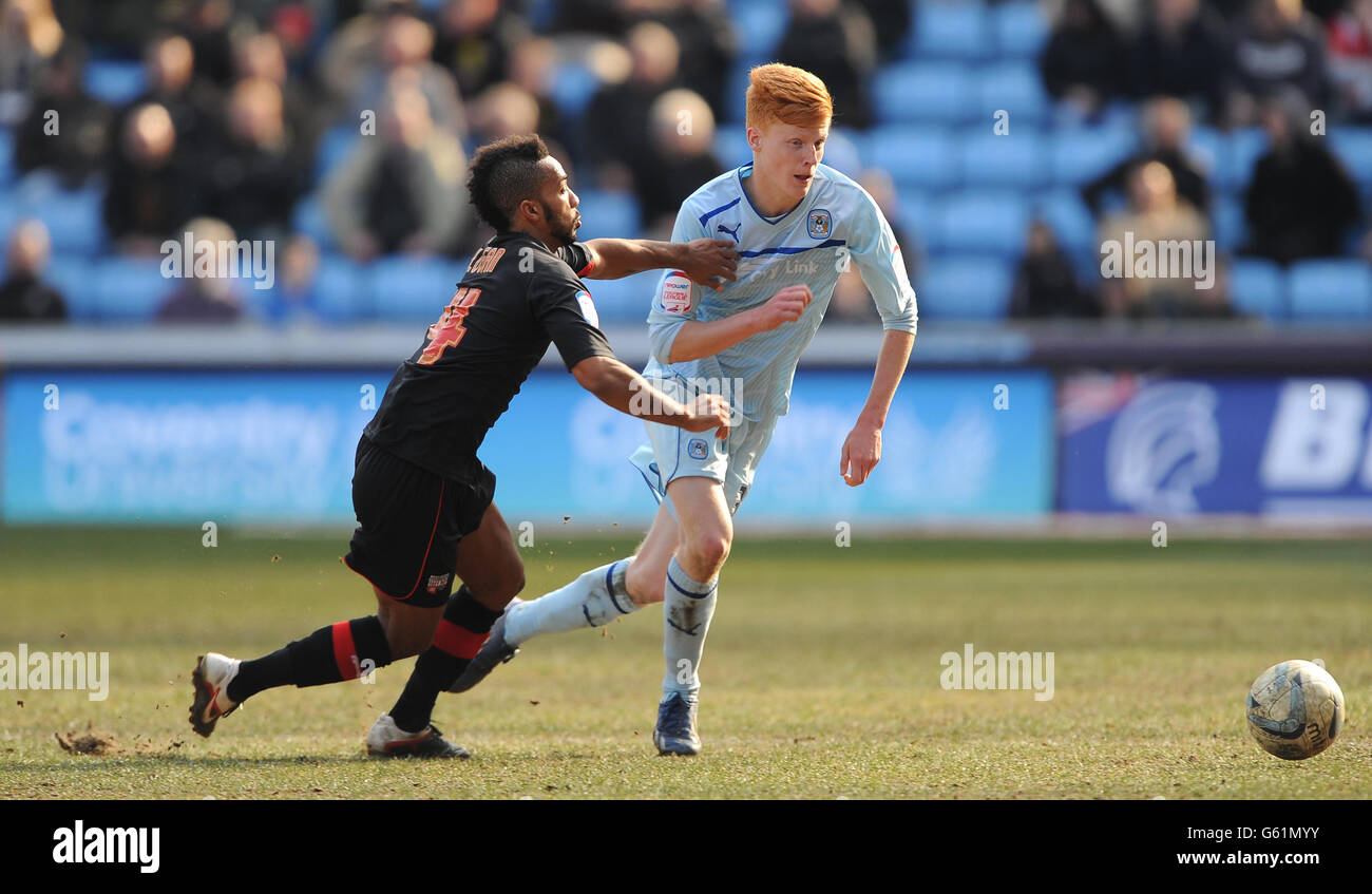 Brentford's Shaleum Logan (left) challenges Ryan Haynes (right) for the ...