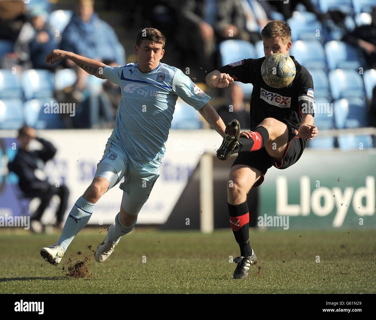 Coventry City's Cody McDonald (left) and Brentford's Tony Craig (right ...