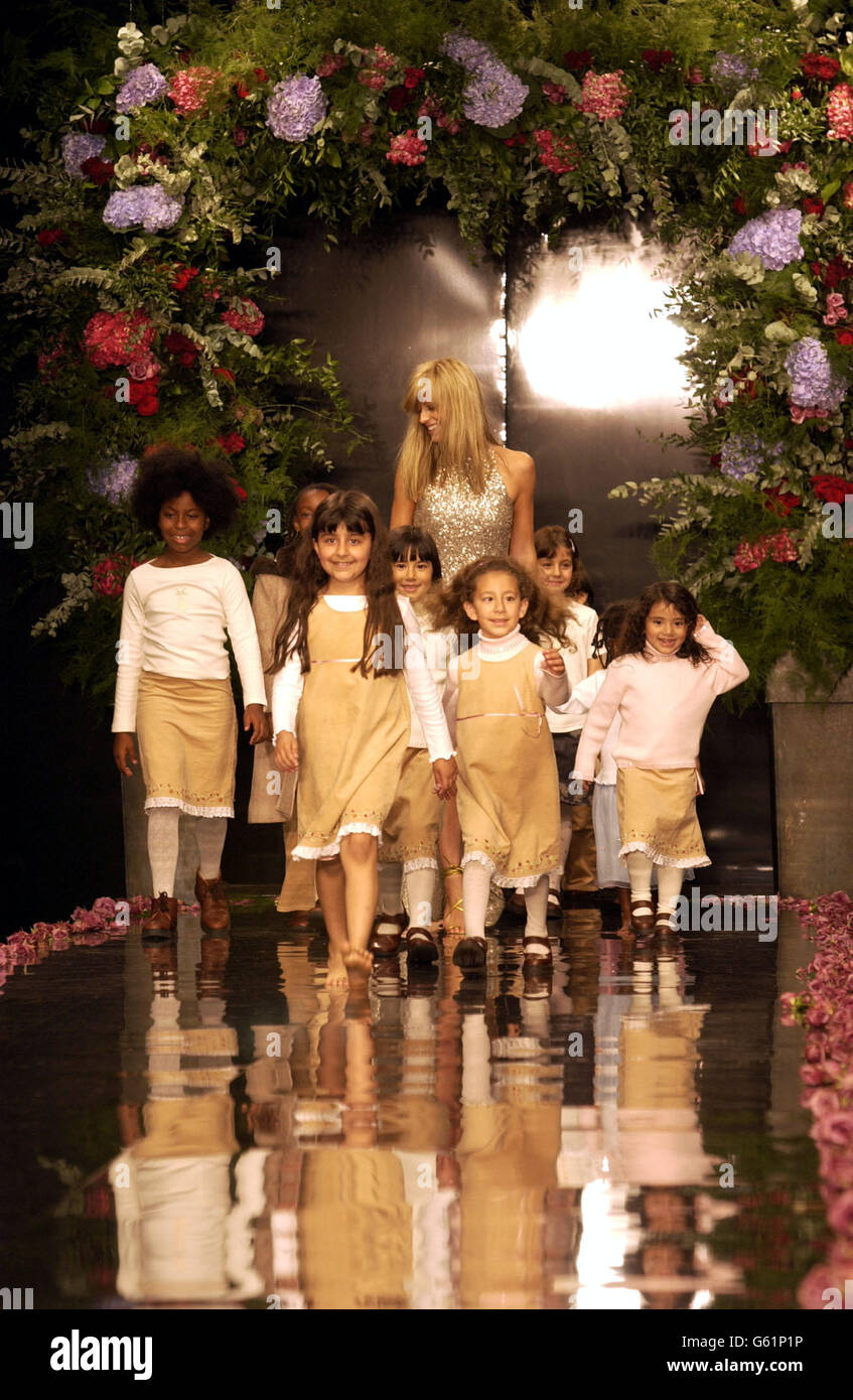 Laura Bailey with children from Barnados on the catwalk at the Elspeth ...