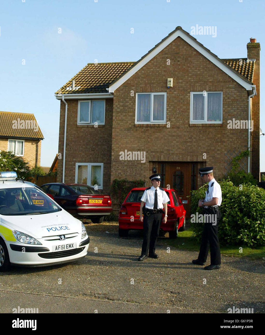 Arrest police officers police car house hi-res stock photography and ...