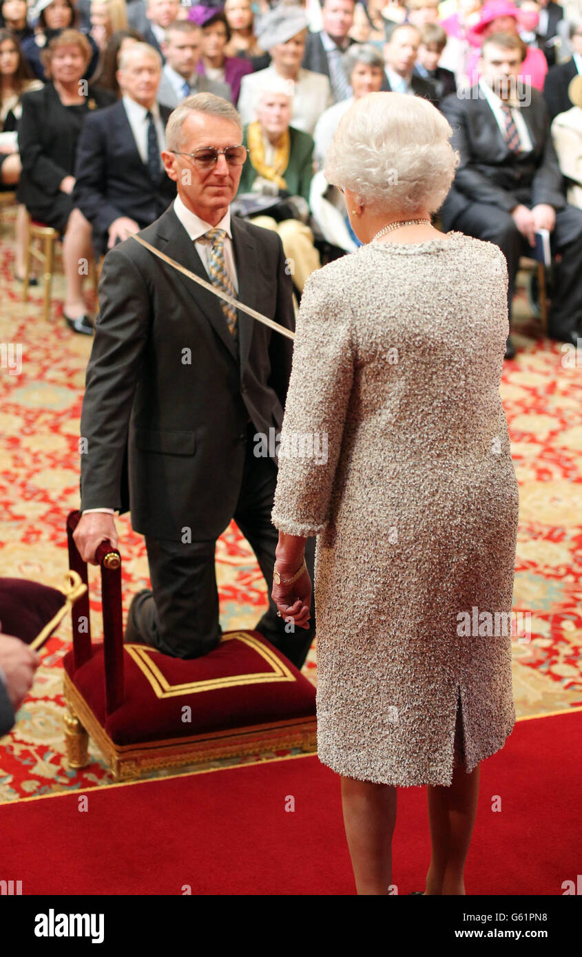 Sir David Tanner receives his knighthood from Queen Elizabeth II during ...