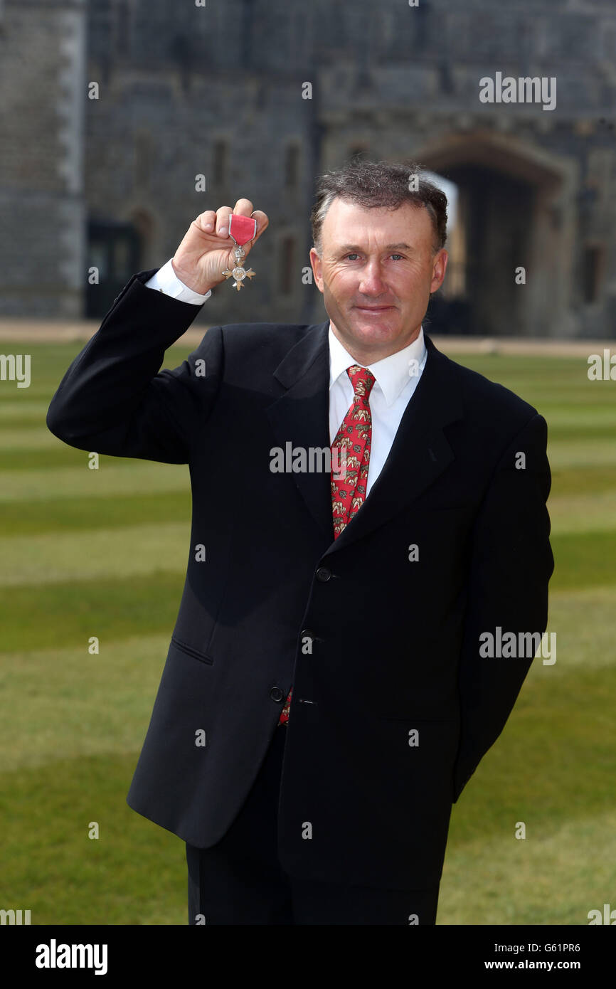 Peter charles poses mbe investiture ceremony windsor castle in windsor ...
