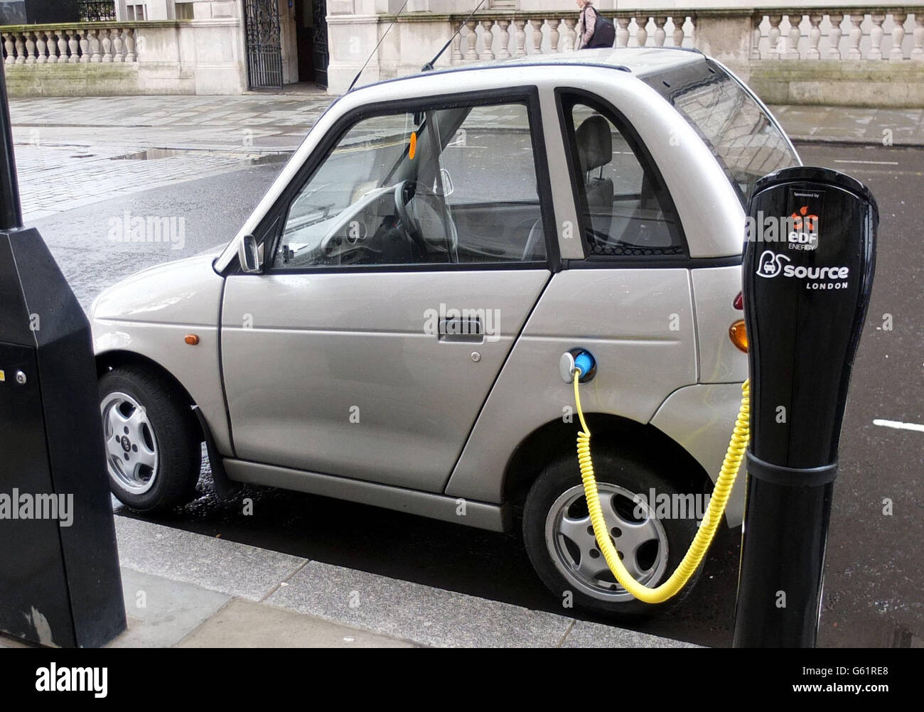 Drivers consider green car Stock Photo - Alamy