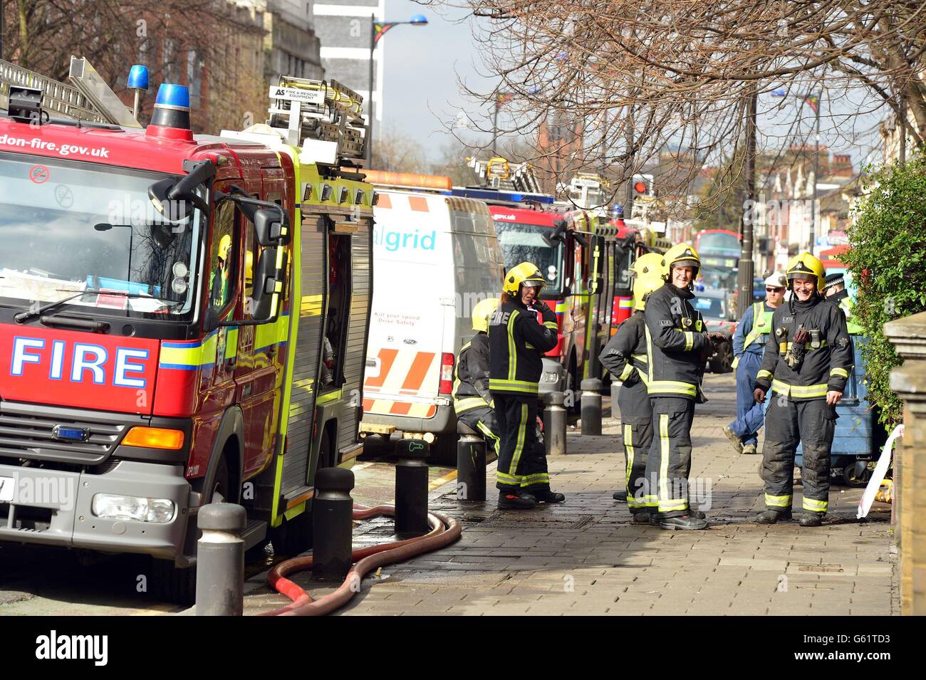 Firefighters outside the remains of a house in Romford Road, Forest ...