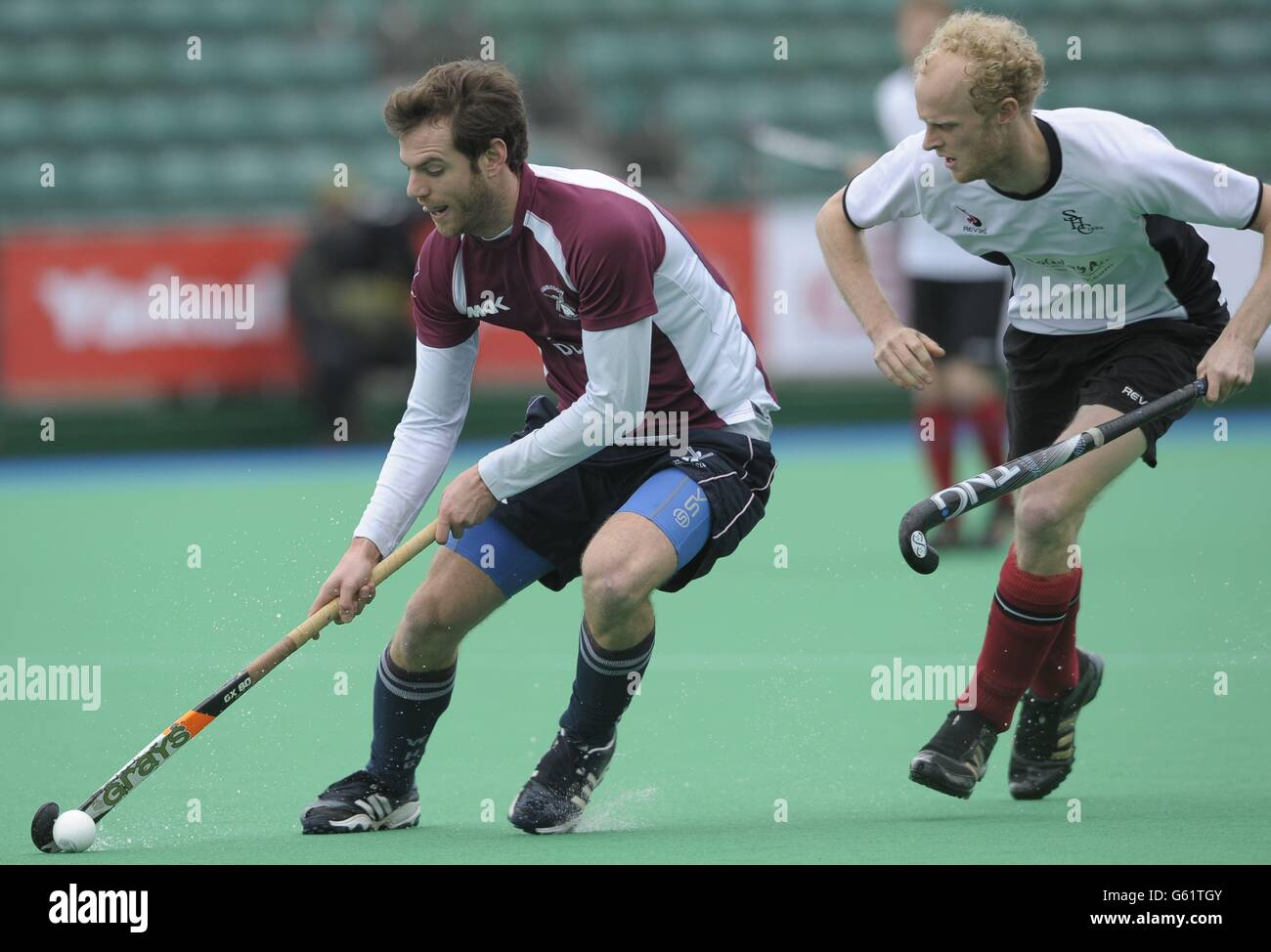 Wimbledon's Rob Pryce (left) is challenged by Southgate's Matt Coombes ...
