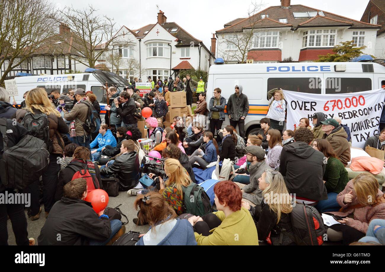 A large group of demonstrators from the direct action group UK Uncut ...