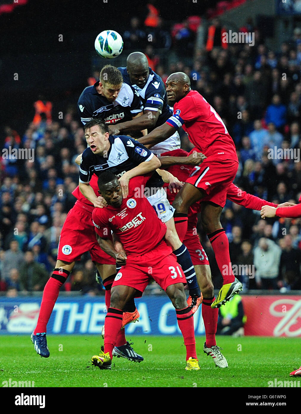 A crowd of players all compete for the ball in the air Stock Photo - Alamy