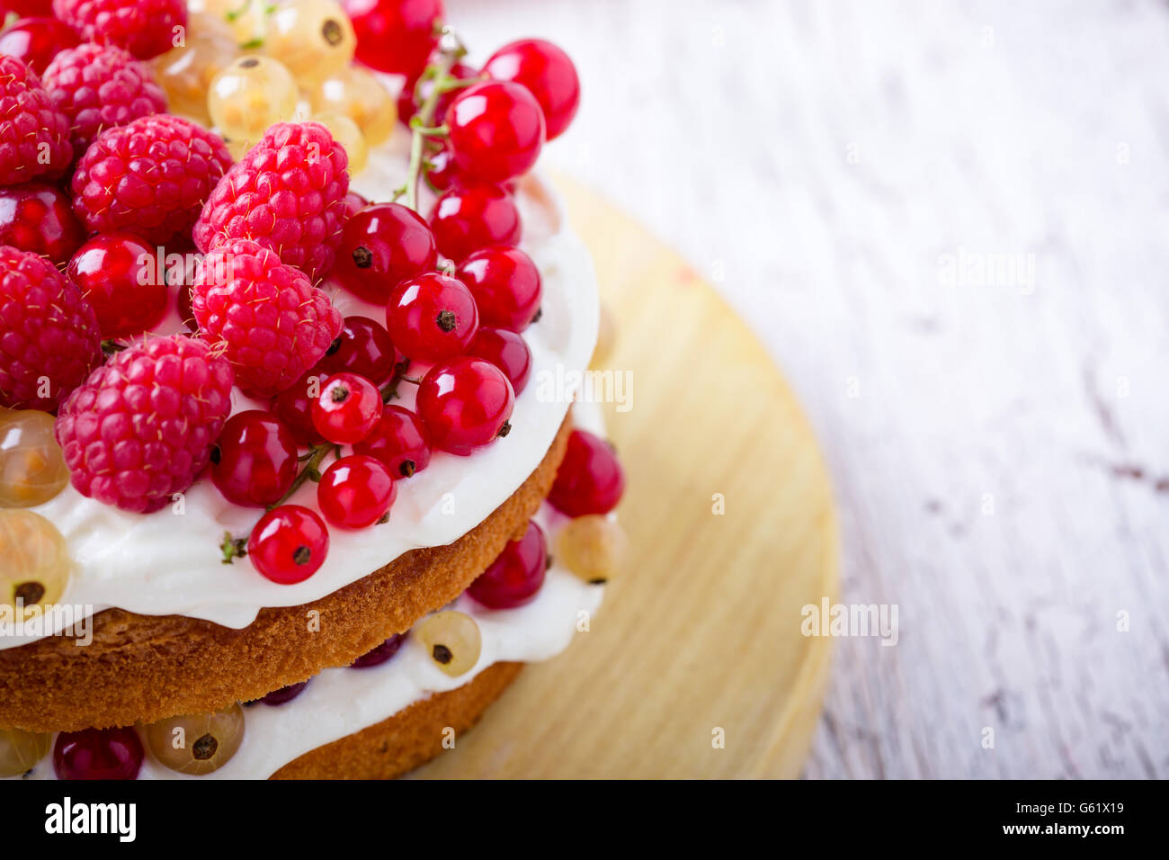 Homemade berries and cream sponge layer cake, tasty summer tea-time ...