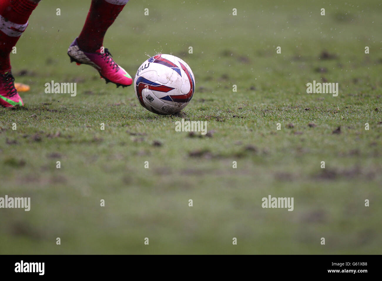 Football in mud hi-res stock photography and images - Alamy