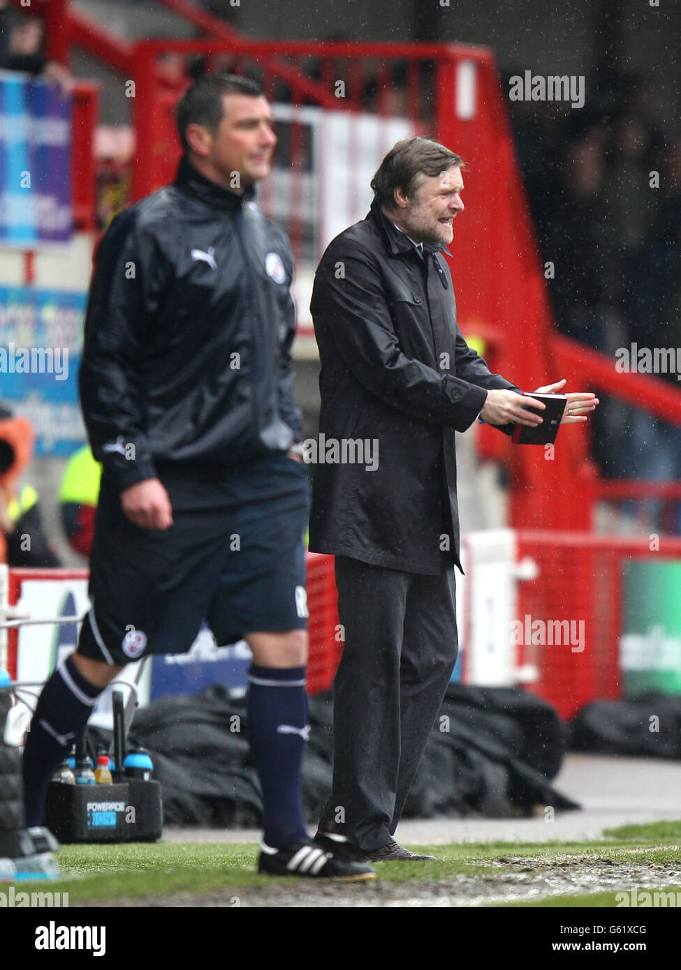Coventry City manager Steve Pressley (right) gestures on the touchline ...