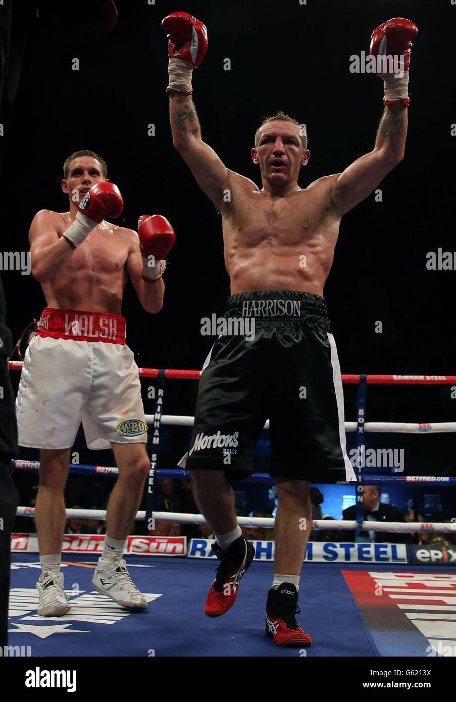 Liam Walsh (left) and Scott Harrison react after the 12th round during ...