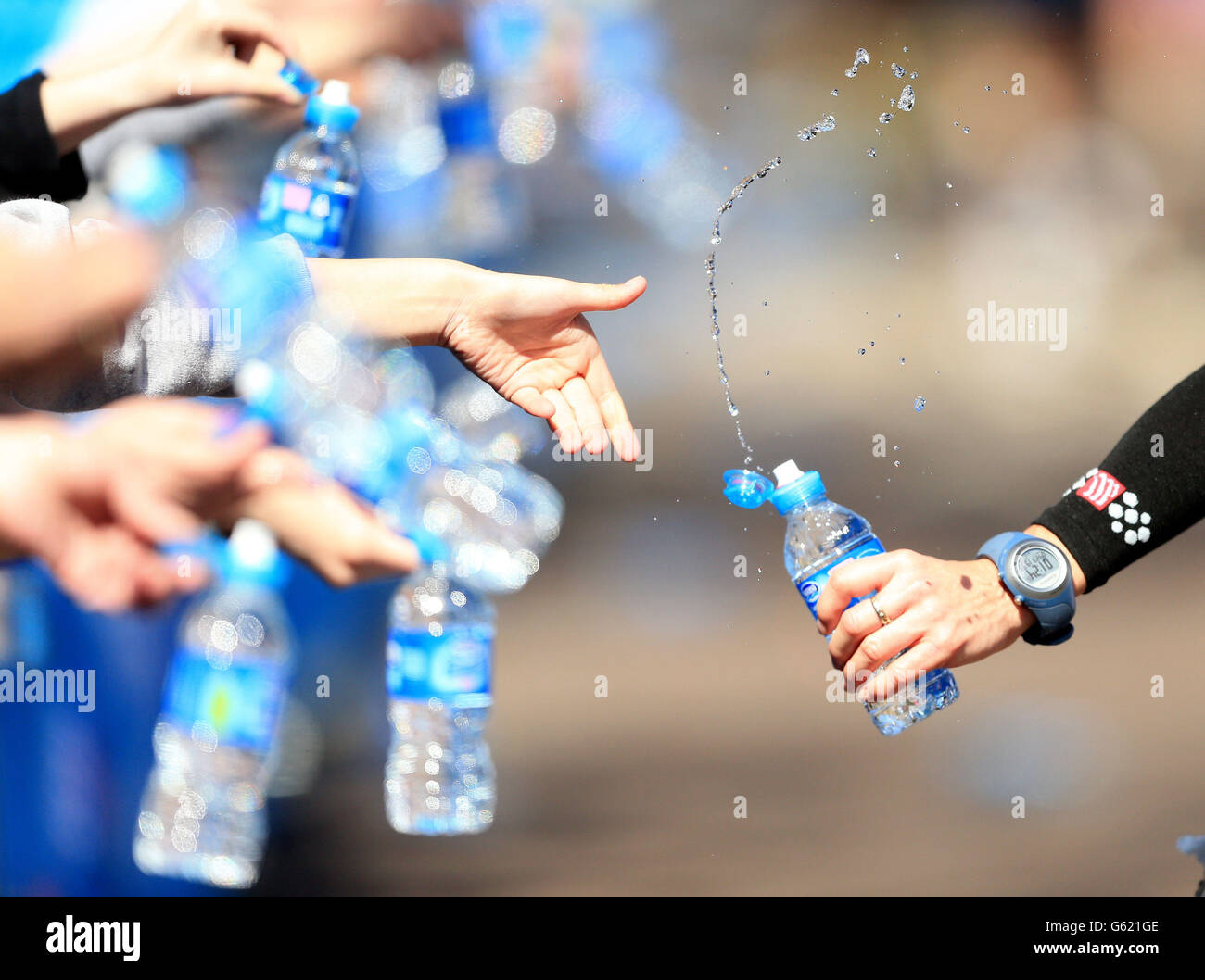 Runners help themselves to water virgin london marathon in london hi ...