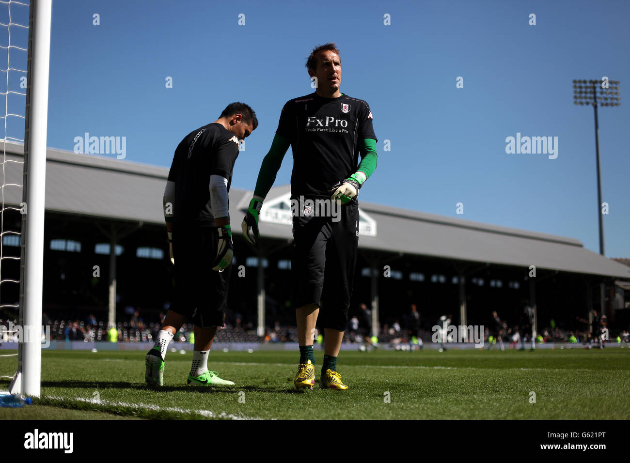 Fulham goalkeeper Mark Schwarzer is put through his paces during the ...