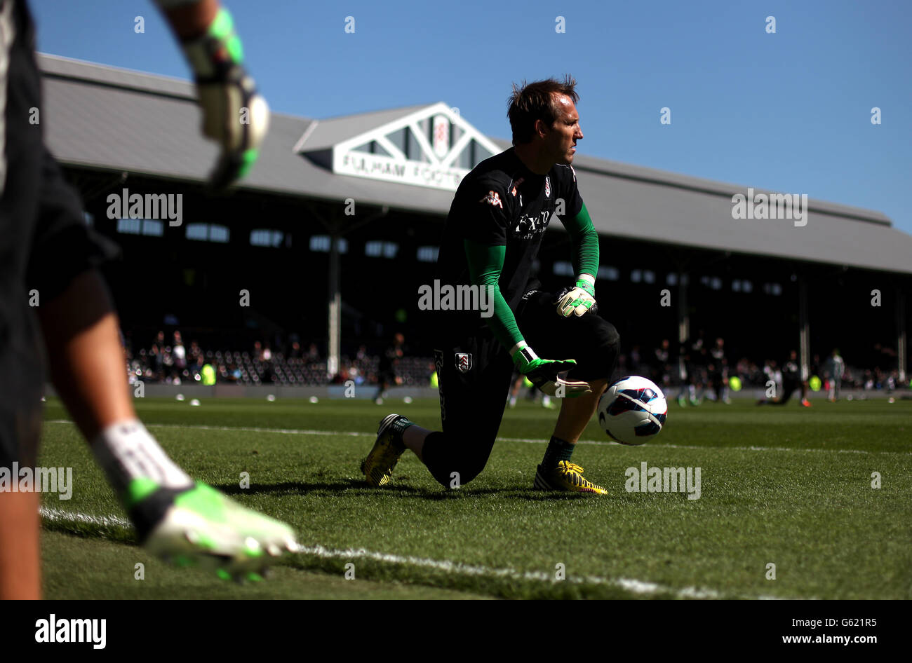 Fulham goalkeeper Mark Schwarzer is put through his paces during the ...