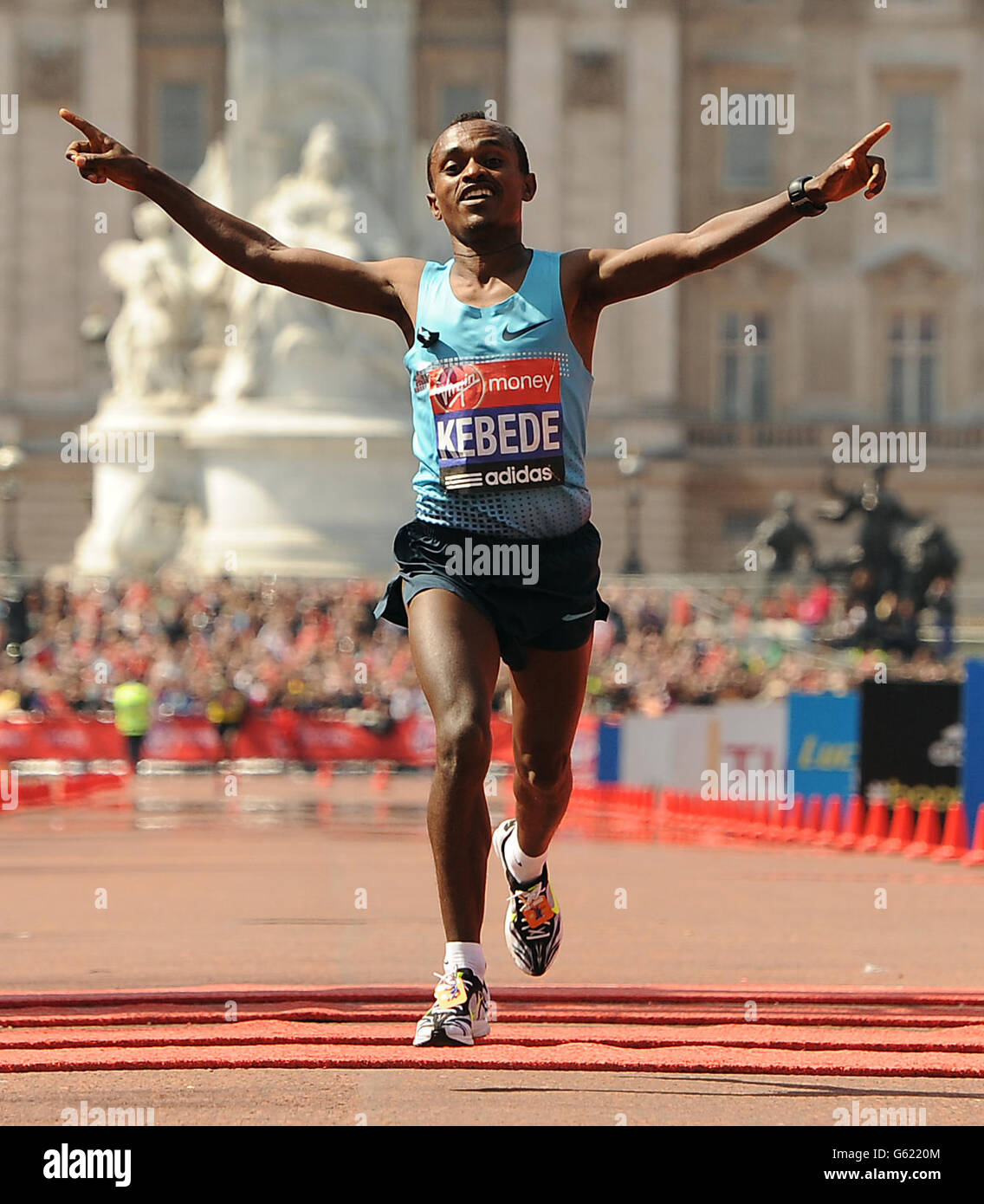 Ethiopia's Tsegaye Kebede crosses the finish line as he wins the Men's Elite race during the ...