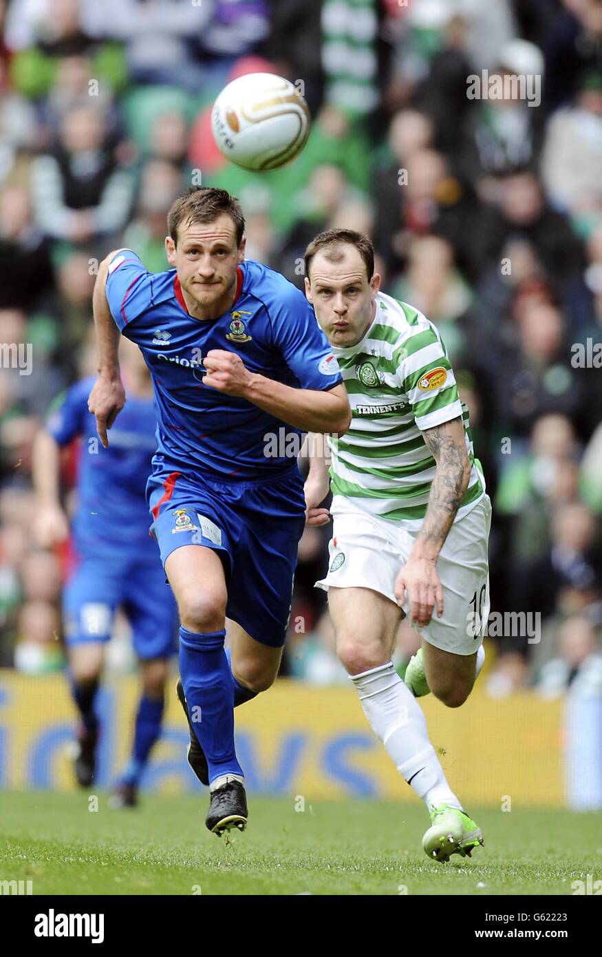 Celtic's Anthony Stokes (right) and Inverness's Gary Warren battle for ...