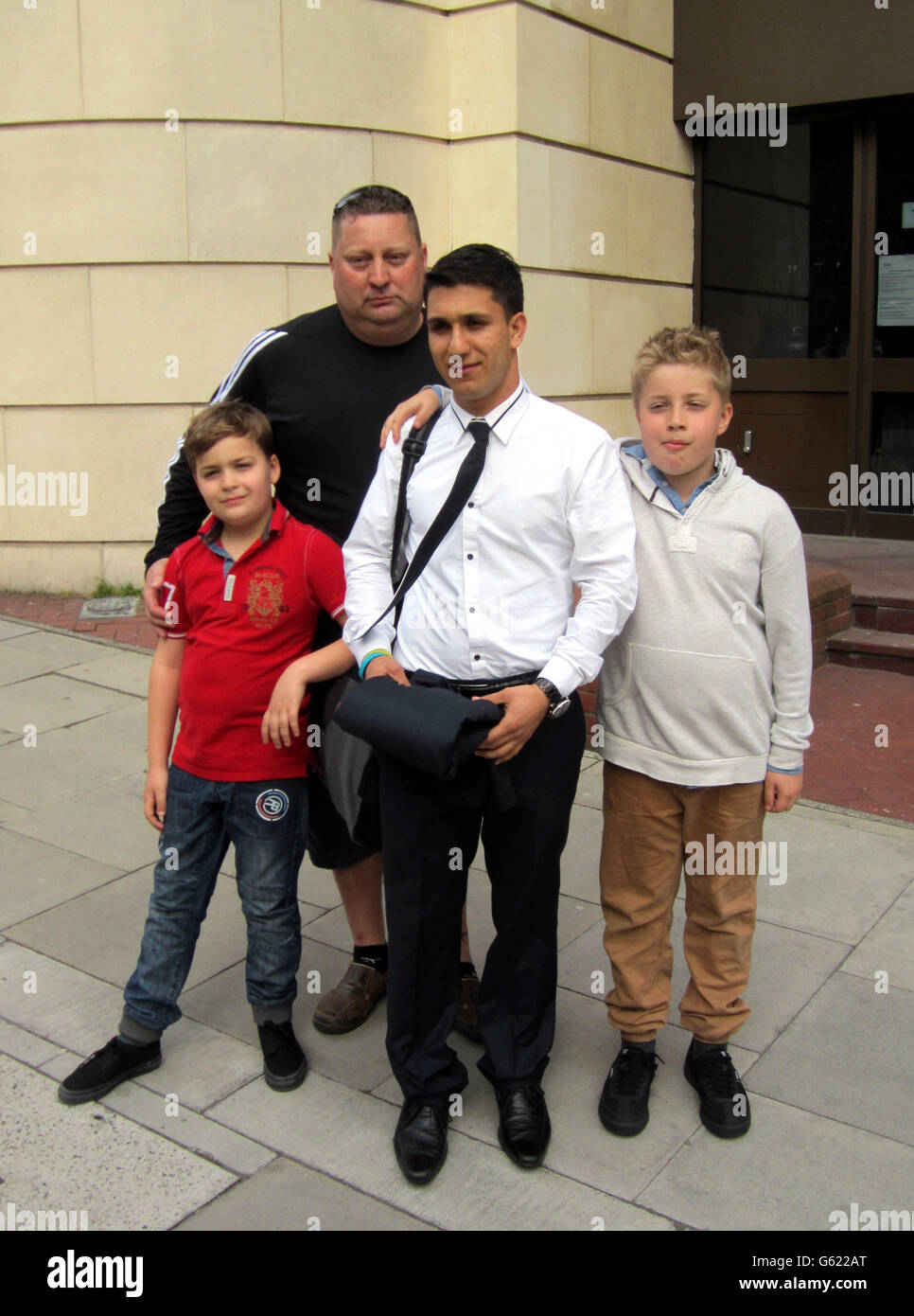 Najibullah Hashimi, 19, (centre) with foster father Steve Griffiths ...