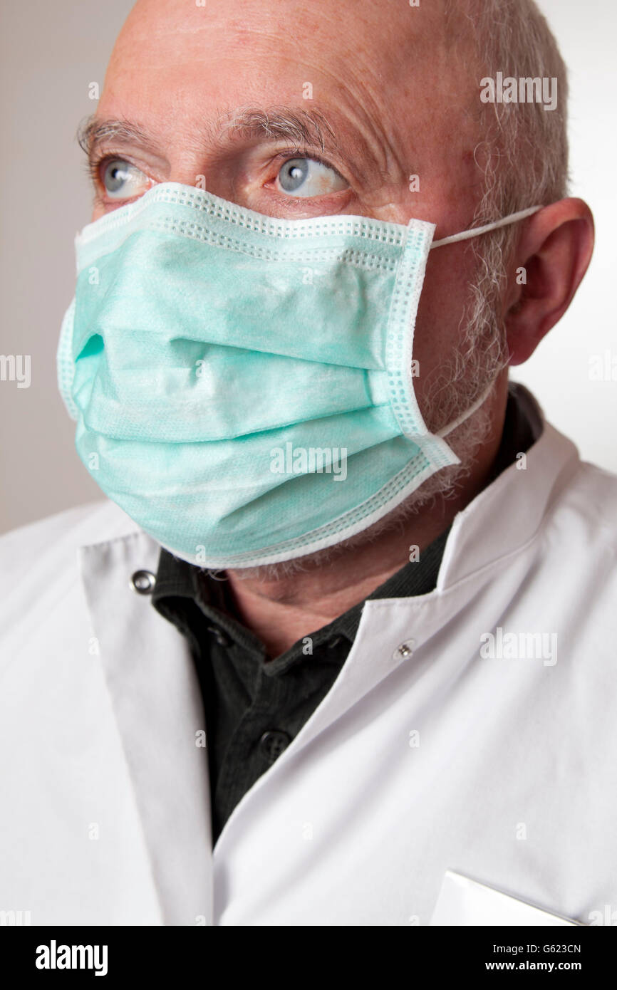 Doctor, physician wearing a white coat and a medical face mask Stock ...