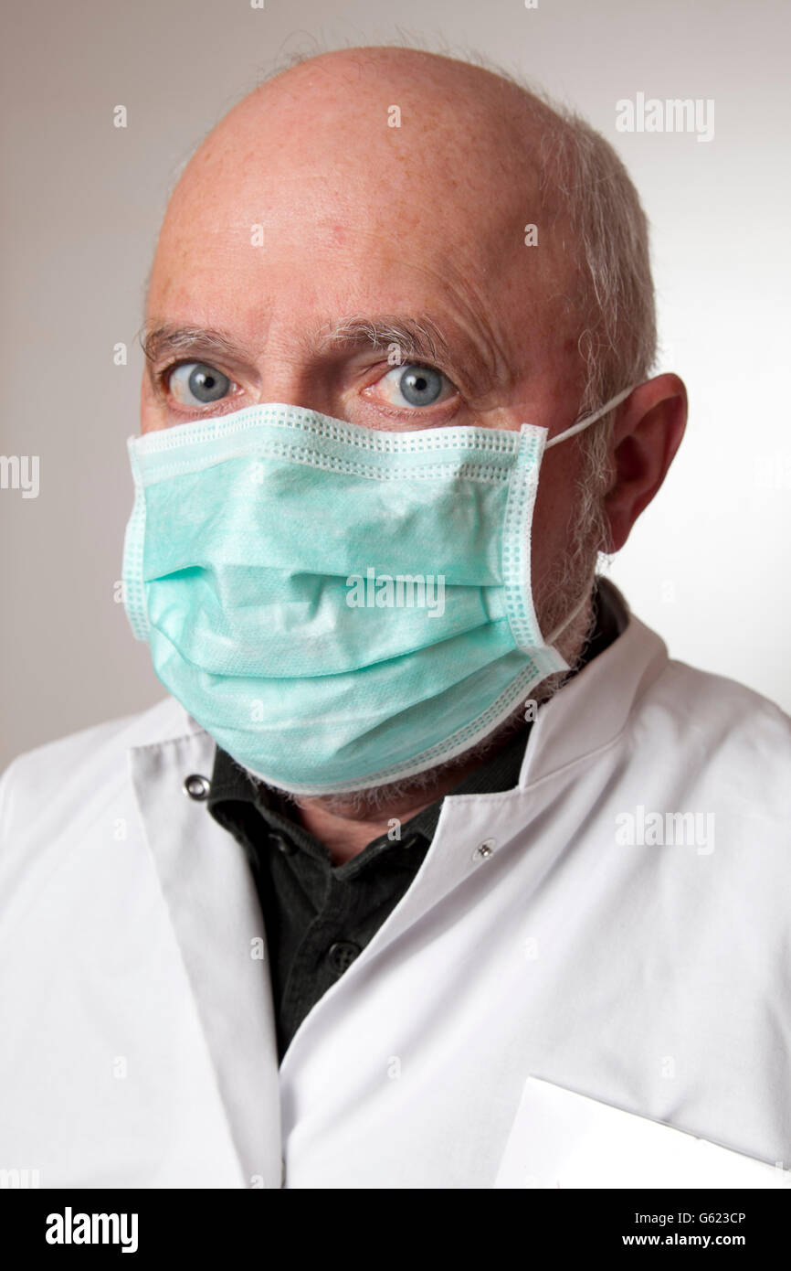 Doctor, physician wearing a white coat and a medical face mask Stock ...