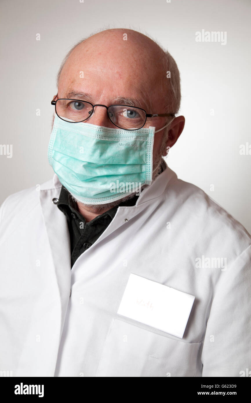 Doctor, physician wearing a white coat and a medical face mask Stock ...