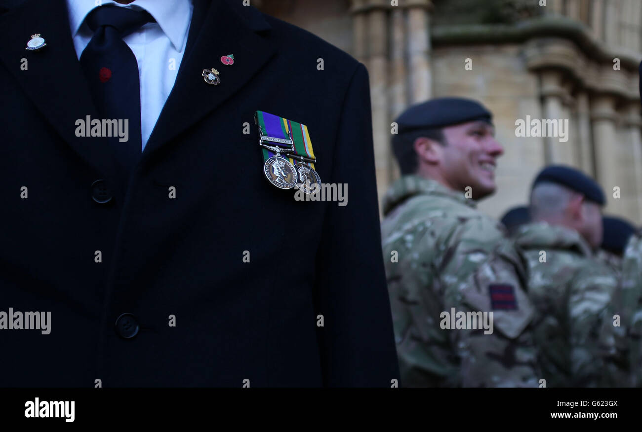 Ex-service men form a guard of honour as troops from 21 Engineer ...