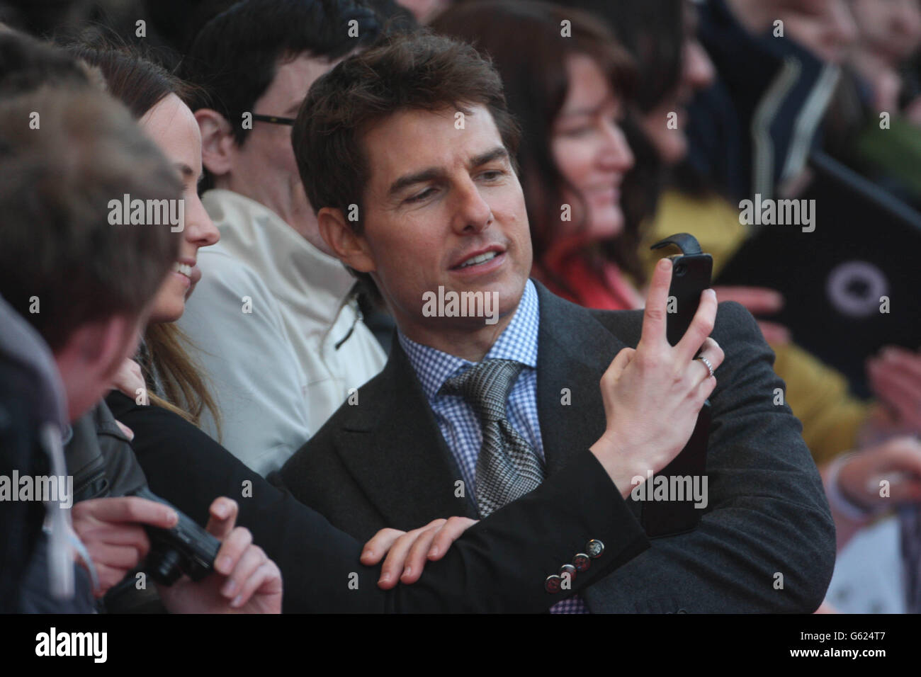 Tom Cruise meets fans on the red carpet for the premiere of Oblivion ...