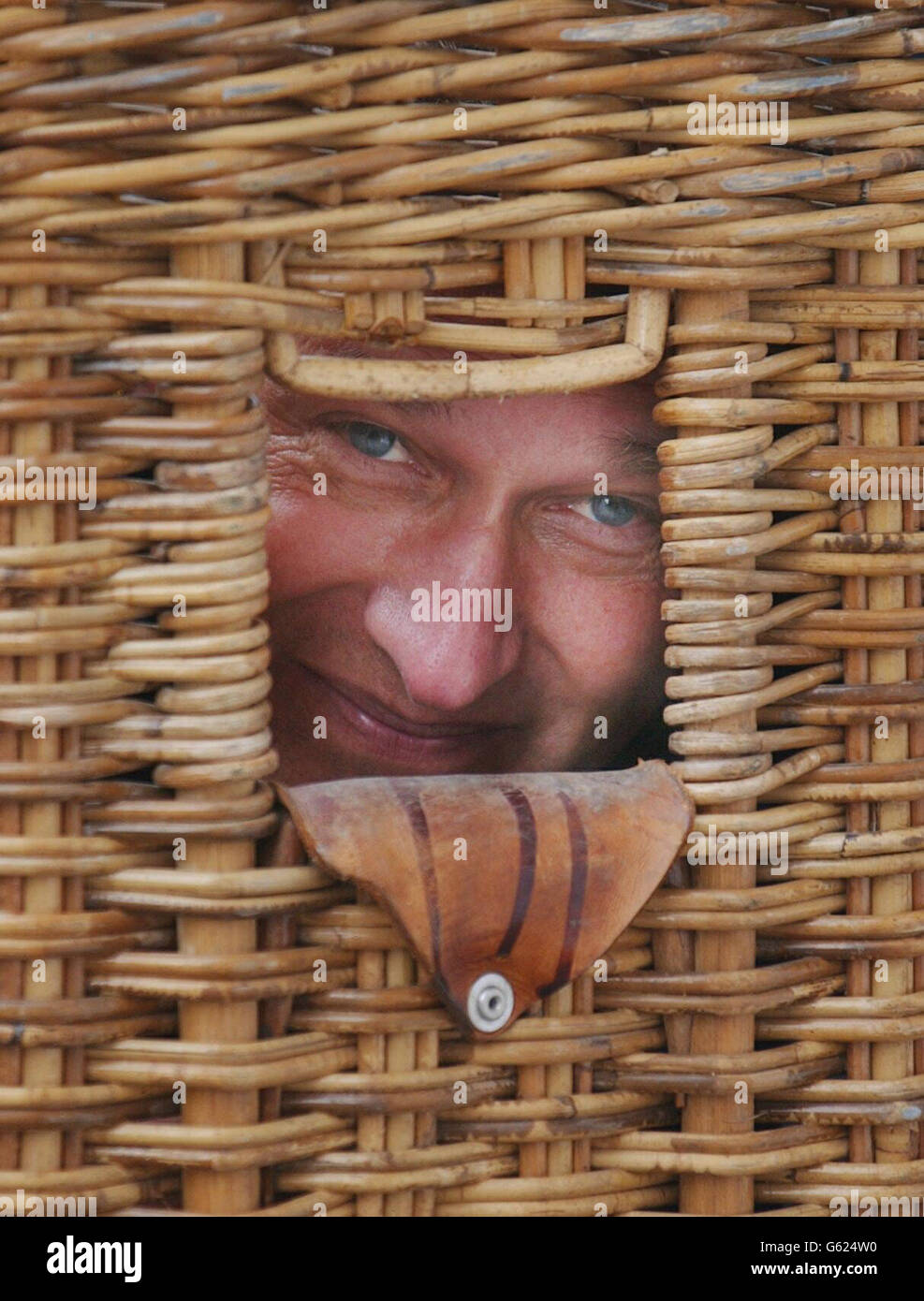 Explorer, David Hempleman-Adams, 45, peers through a hole in his ...