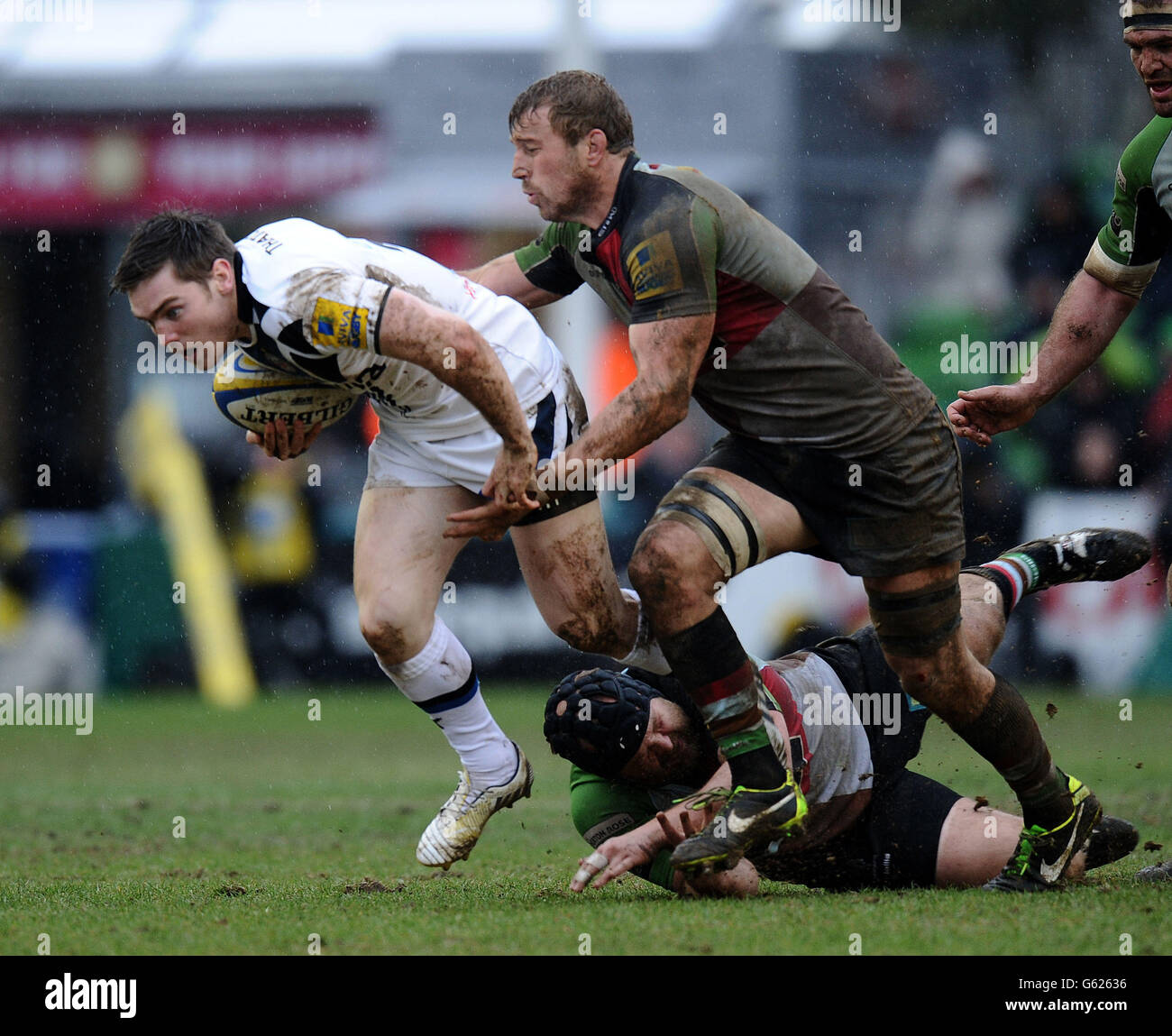 Bath Rugby's Tom Heathcote tackled by Chris Robshaw (right) and Nathan ...