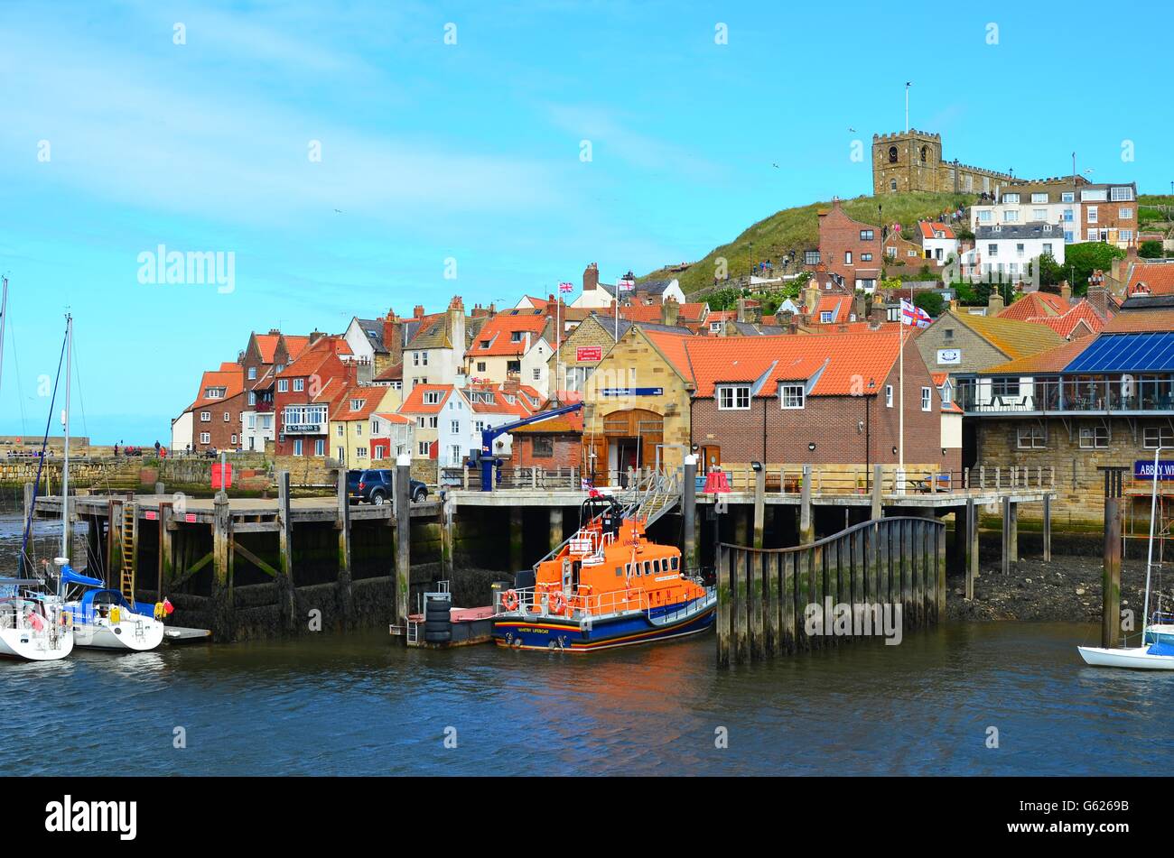 RNLI Life Boat in Whitby harbour with the Abbey in the distance Stock ...