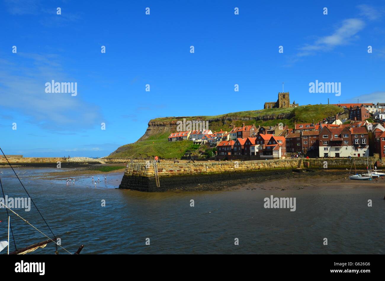A view of Whitby Abbey across the Harbour of Whitby in the North ...