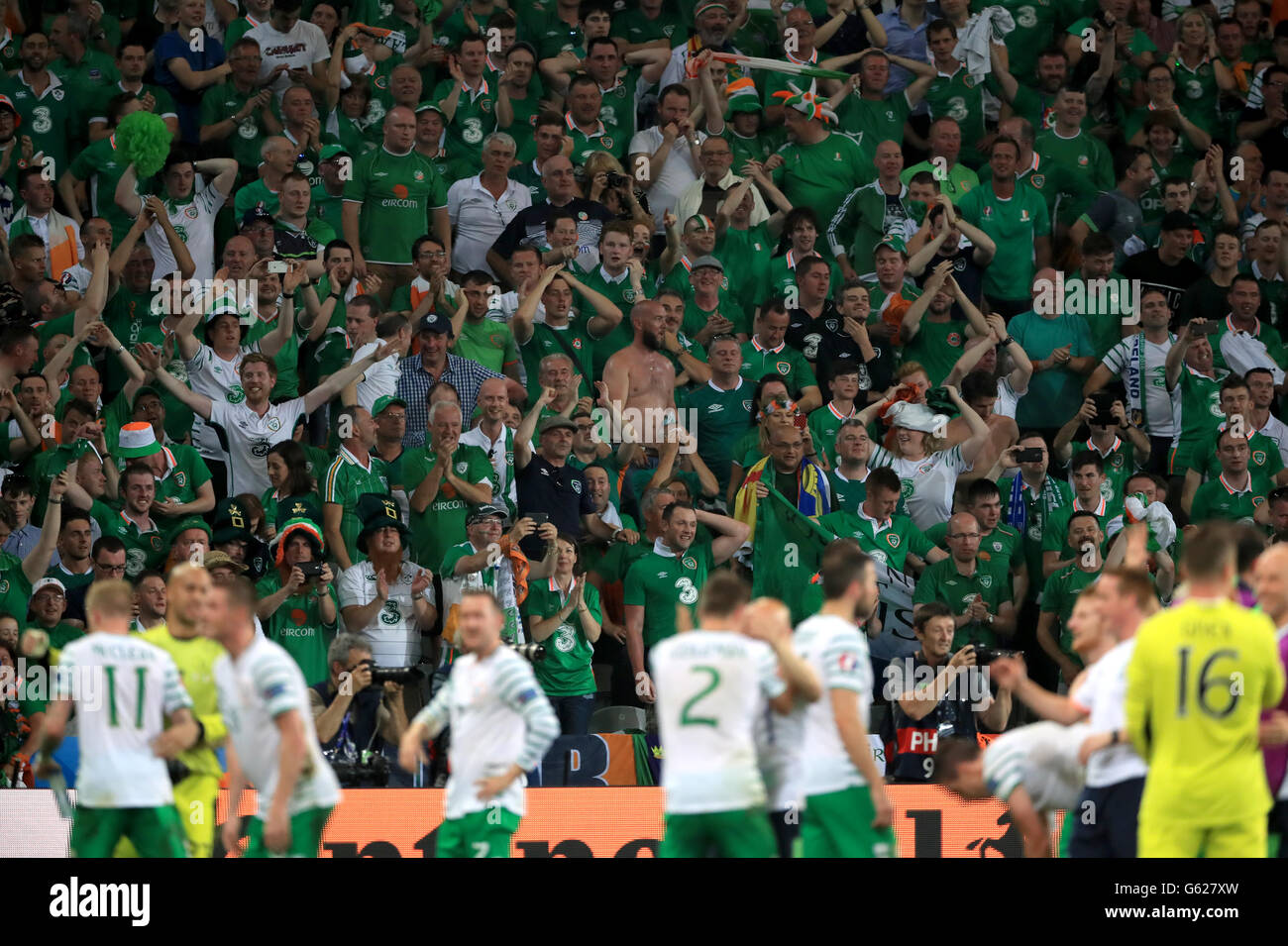 Fans celebrate in the stands as Republic of Ireland players celebrate ...