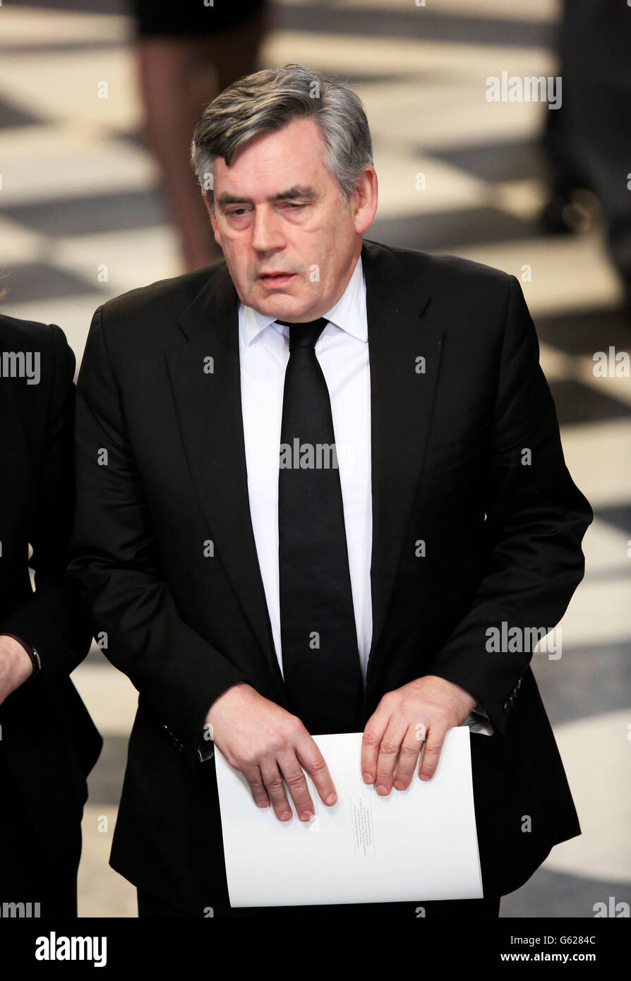 Former Prime Minister Gordon Brown leaves the funeral service of ...