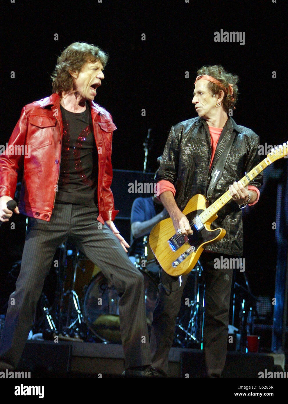 Celebrity music singing playing guitar red leather jacket hi-res stock ...