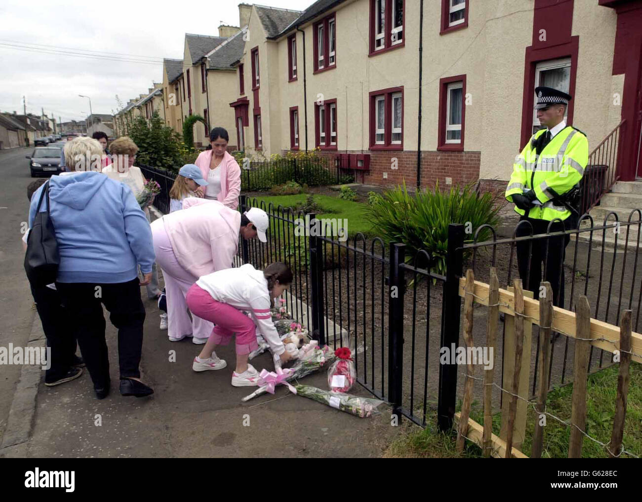 Neighbours and friends leave flowers outside a house in stonehouse hi ...
