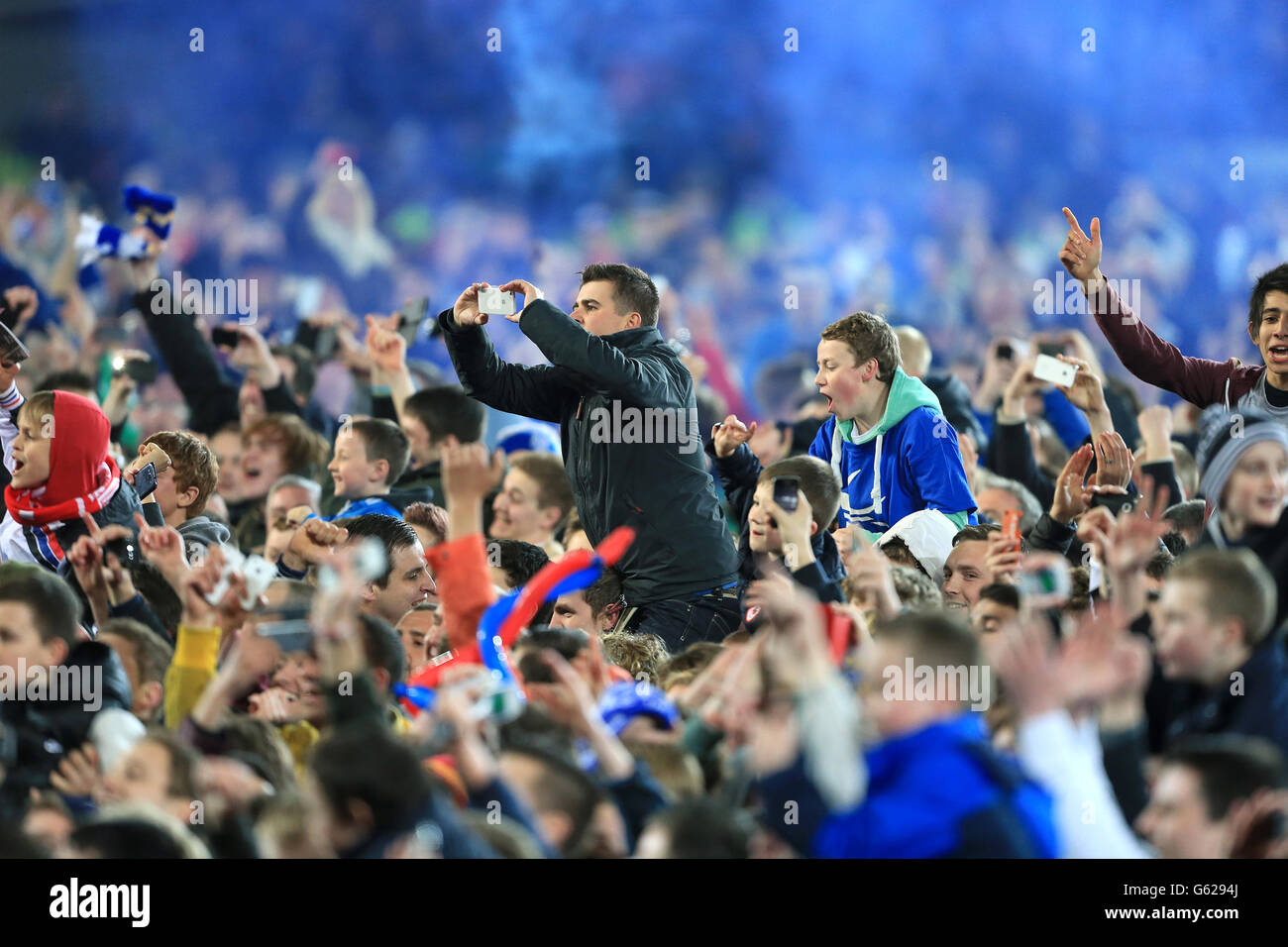 Cardiff city fans invade the pitch as they celebrate promotion hi-res ...