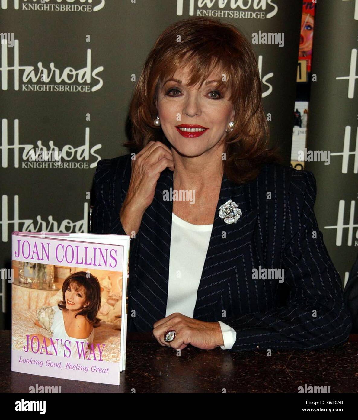 Actress Joan Collins with her new book 'Joan's Way' during a signing ...
