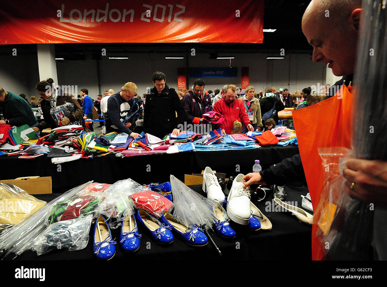 Members of the public attend the LOCOG sale of hundreds of items that ...