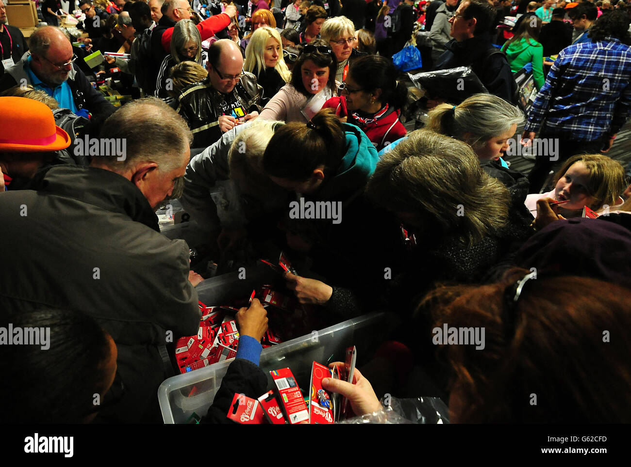 Members of the public attend the LOCOG sale of hundreds of items that ...