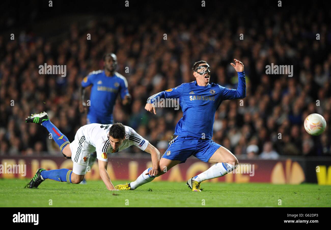 Chelsea's Fernando Torres (right) and Basel's Fabian Schar battle for ...