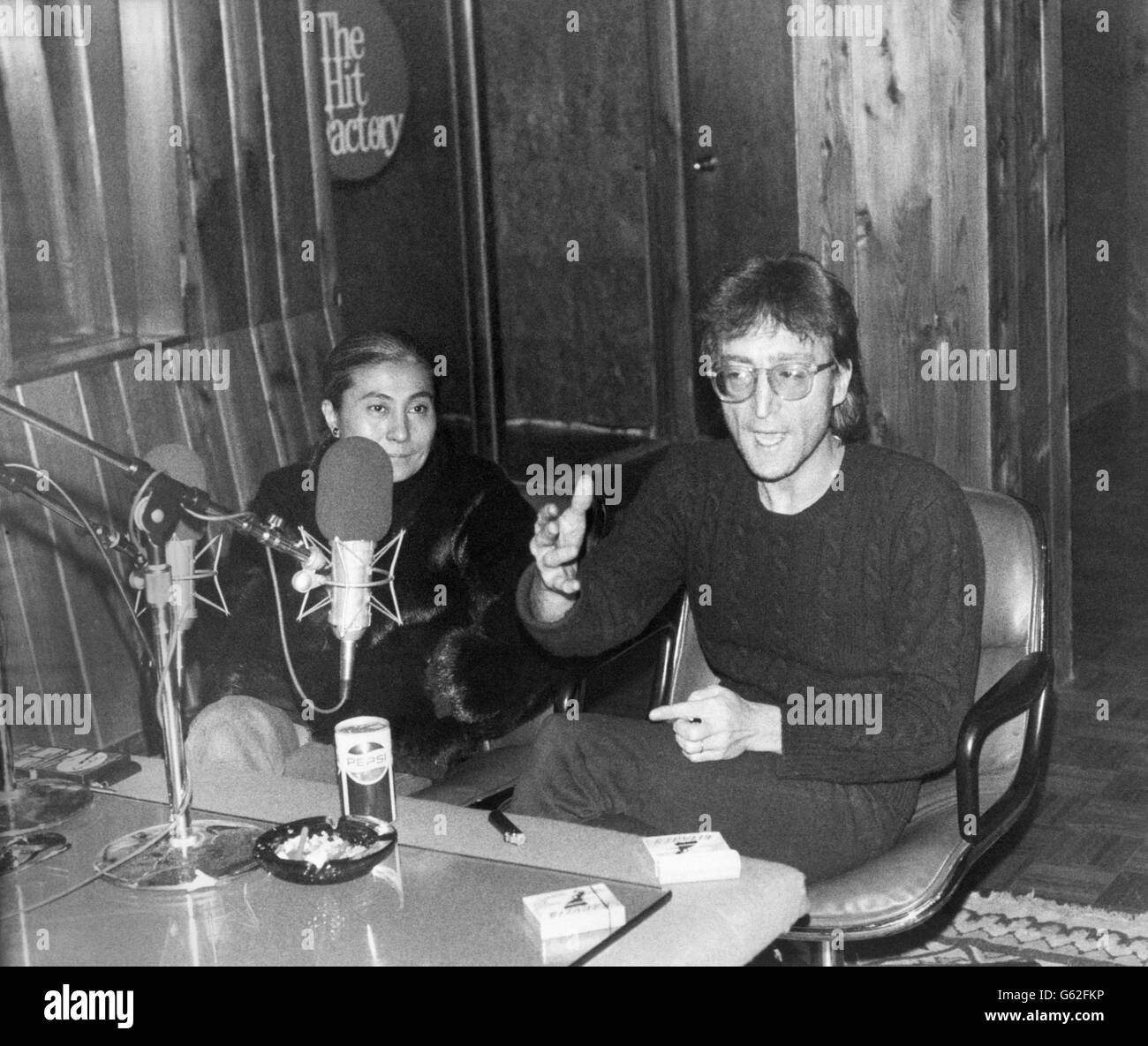 Former Beatles star John Lennon sat alongside his wife Yoko Ono during ...